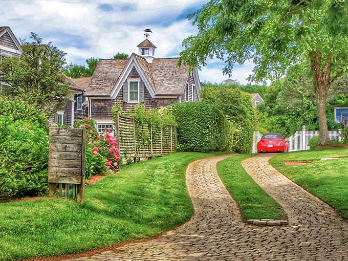Cape Cod charm meets weathered shingles and climbing roses in this dreamy coastal scene that whispers summer.