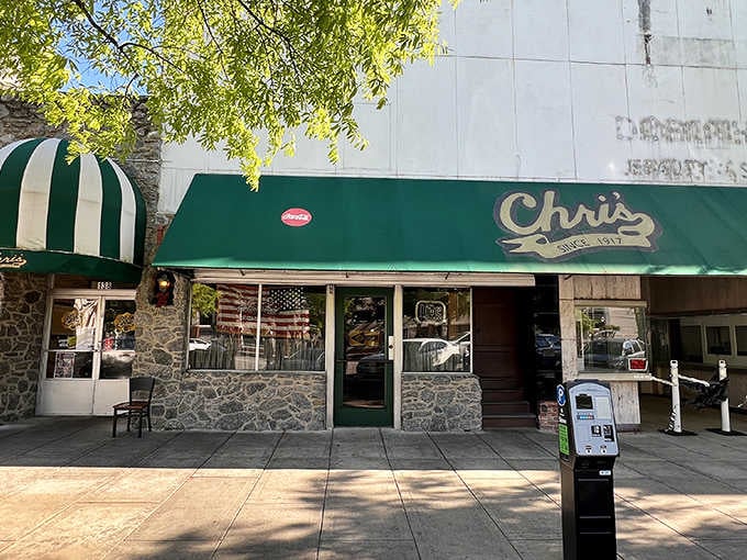 That green awning and stone facade signal downtown Montgomery's hot dog headquarters where lunch dreams come true daily.
