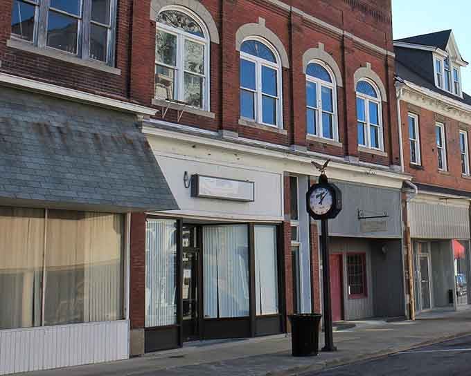 Classic storefronts with arched windows remind you that some towns never forgot how to be charming.