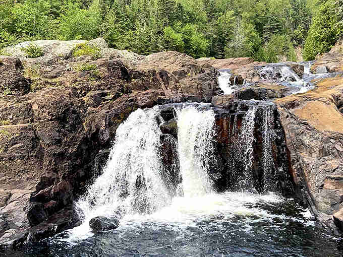 White water crashes over rust-colored stone in a display that's mesmerized visitors for generations seeking answers.