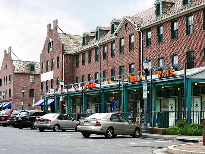 Those green awnings and brick storefronts give Dundalk a neighborhood charm that reminds you why Main Streets matter.