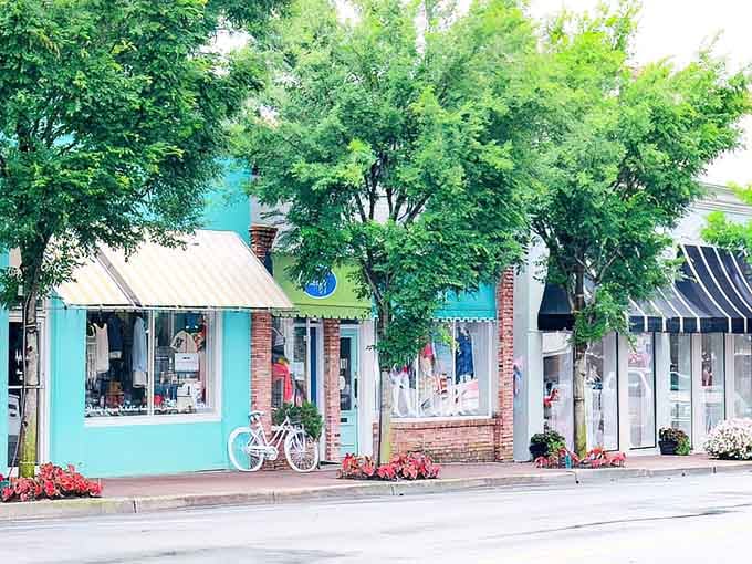 That turquoise storefront wrapped in flowers and shade trees proves small-town charm isn't just a saying.