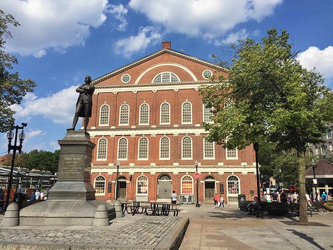That gorgeous red brick building practically glows under blue skies, making history feel warm and inviting instead of dusty.