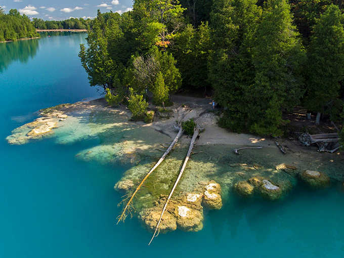 That turquoise water looks like someone Photoshopped the Caribbean into upstate New York, but it's gloriously real.