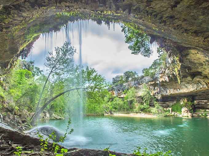 Nature's cathedral features a limestone dome, emerald pool, and waterfall that'll make you believe in magic again.