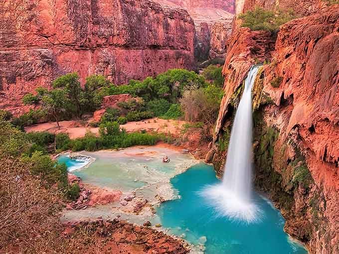 That turquoise pool against red canyon walls looks like Mother Nature showing off her best work.