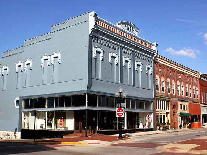 These pastel storefronts look like someone colorized an old postcard and brought Main Street back to life.