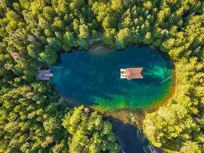 That emerald water looks like someone dropped food coloring in the world's clearest swimming pool, absolutely mesmerizing.
