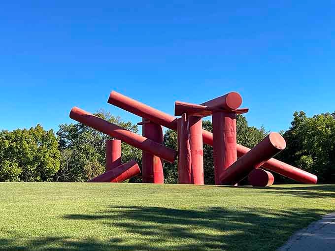 These massive red logs look like a giant's game of pick-up sticks frozen mid-tumble on the lawn.