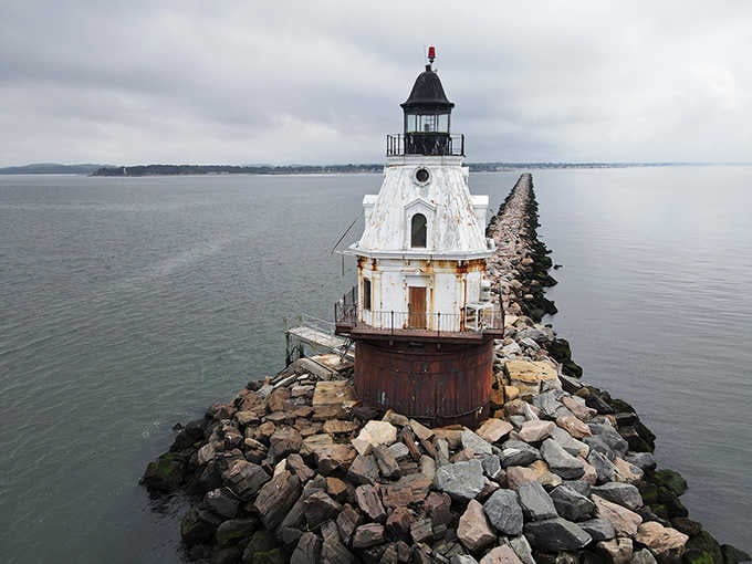 Standing proud on its rocky foundation, this weathered beauty has guided sailors through gray skies for generations.