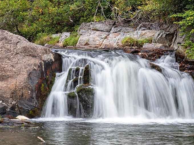 Nature's own multi-tiered fountain cascades over ancient granite like liquid silk in motion.