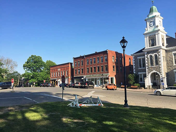 That clock tower standing proud over brick storefronts is pure New England elegance at its finest.