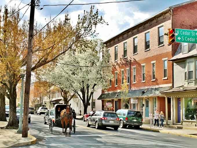 Horse-drawn carriages clip-clopping past brick storefronts where time moves slower and stress evaporates like morning dew.