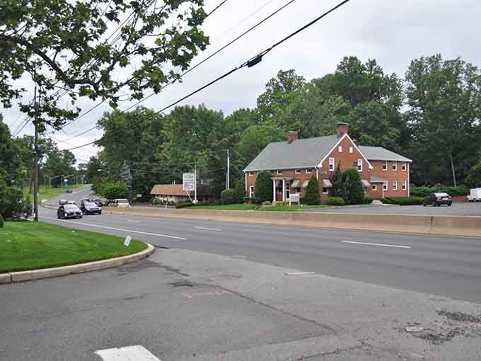 Classic brick buildings and mature trees create the kind of peaceful streetscape where neighbors still wave to each other.