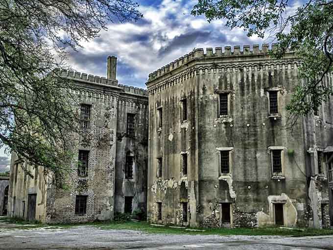 This Gothic fortress looks like it could've housed Batman's villains, with castle-like battlements and weathered stone walls.