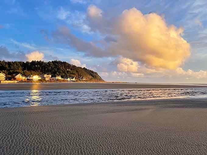 Golden hour clouds paint the sky while gentle waves kiss the shore: this is coastal perfection at its finest.