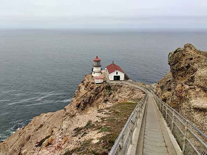 That walkway to the red-capped lighthouse looks like the path to the edge of the world itself.