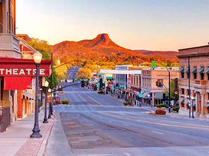 Golden hour transforms this downtown into a Western movie dream, complete with that magnificent mountain standing guard overhead.