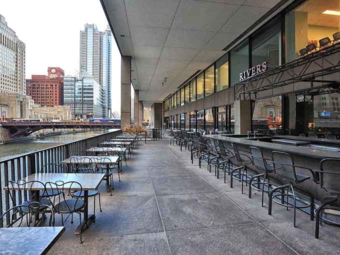 Downtown dining meets waterfront magic where Chicago's skyline towers above your riverside table like urban theater.