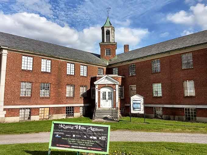 That clock tower watches over brick wings that have witnessed more than a century of whispers and shadows.