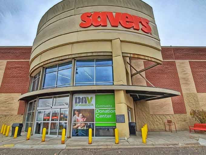 That curved entrance with bold red letters beckons like a lighthouse for bargain hunters seeking their next great find.