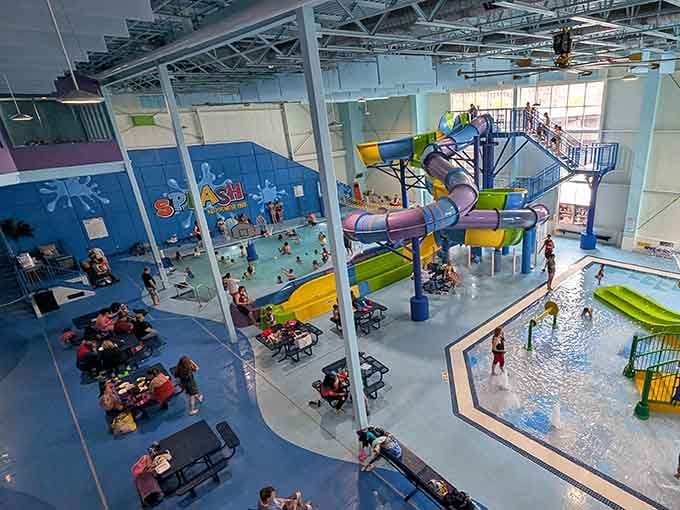 Indoor water parks prove winter doesn't have to win—colorful slides twist overhead while families splash below year-round.