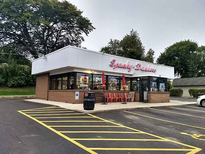 That playful pink script against classic brick tells you everything: this place takes donuts seriously but doesn't take itself too seriously.