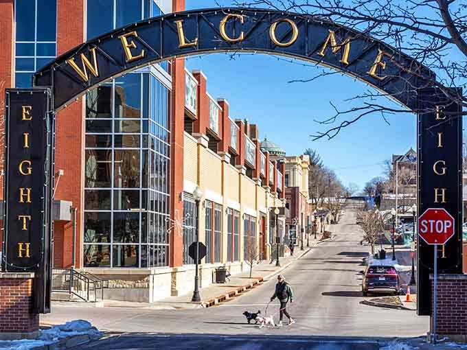 That welcome arch frames a street where neighbors still walk their dogs and actually know each other's names.
