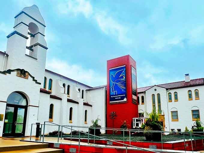 That bold red tower against white stucco walls creates an unexpected splash of Russian artistry right here.