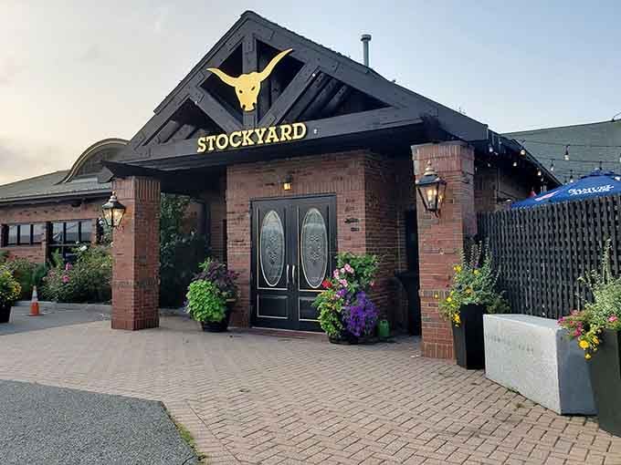 That golden longhorn above the entrance promises serious beef, and those elegant double doors deliver on every promise.