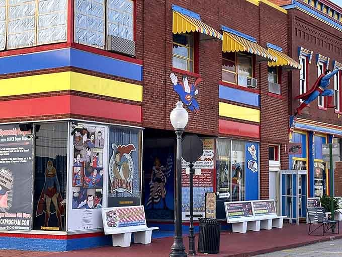 When a town commits to Superman, they really commit with colorful buildings and heroes scaling the walls.