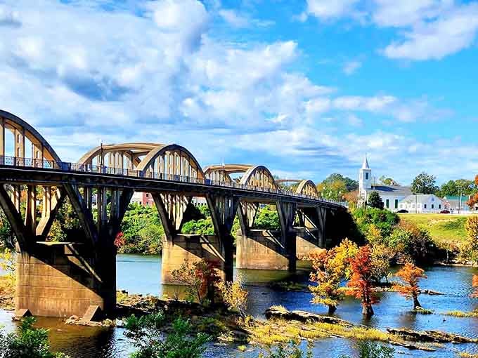 That arched bridge over the Coosa River with fall colors bursting below is pure postcard perfection.