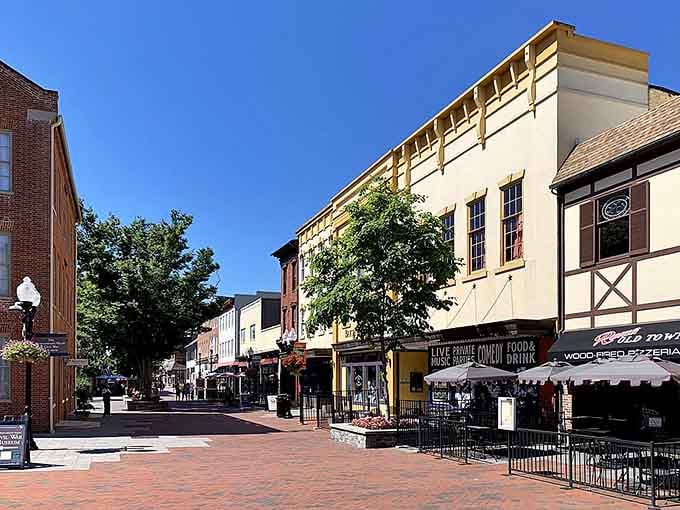 Winchester's downtown pedestrian mall invites leisurely strolls past outdoor cafes and charming storefronts under sunny skies.
