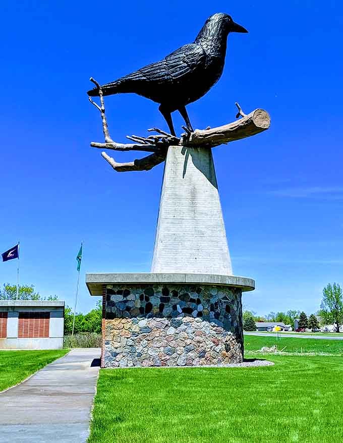 That beautiful stone mosaic base proves someone really cared about making this oversized bird look absolutely magnificent.