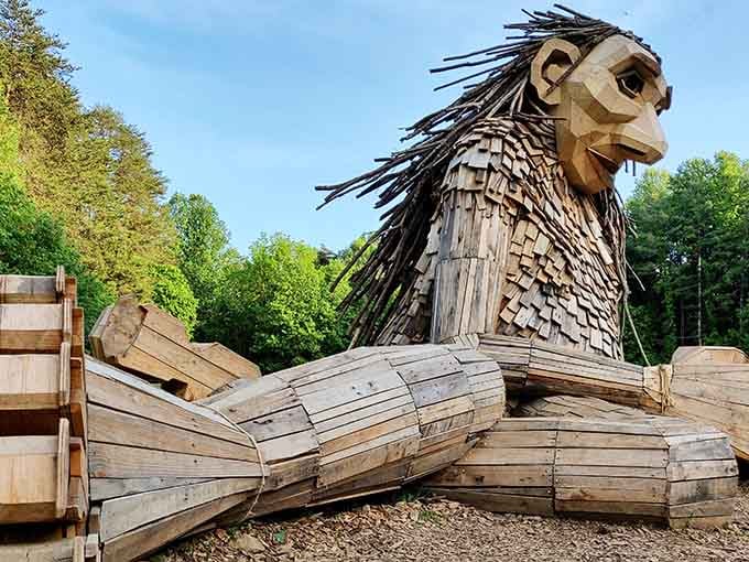 This magnificent wooden sphinx guards the forest trails with the wisdom of ages and whimsical charm.