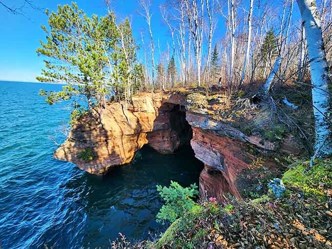 These layered red cliffs frame turquoise water so perfectly, you'd swear someone staged it for postcards.