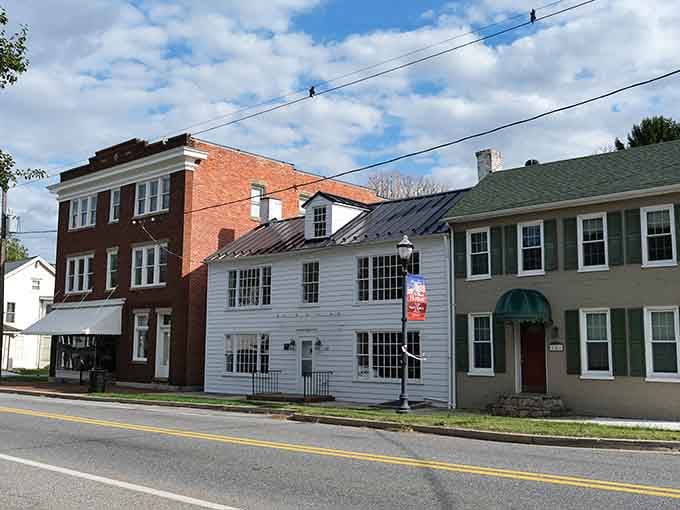 Historic buildings standing shoulder to shoulder like old friends who've weathered every storm together since the 1800s.