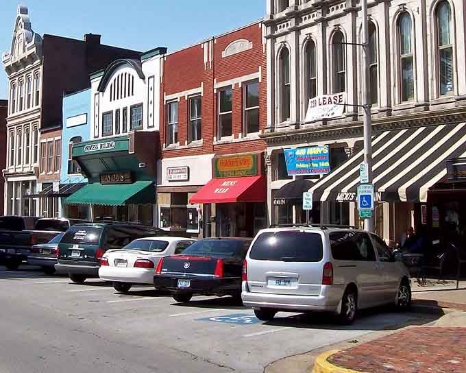 These storefronts wear their history proudly, each brick building telling stories that stretch back generations.