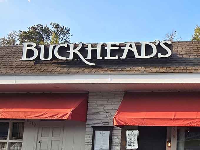 Those bright orange awnings under blue skies signal good times ahead, like a beacon for hungry travelers.