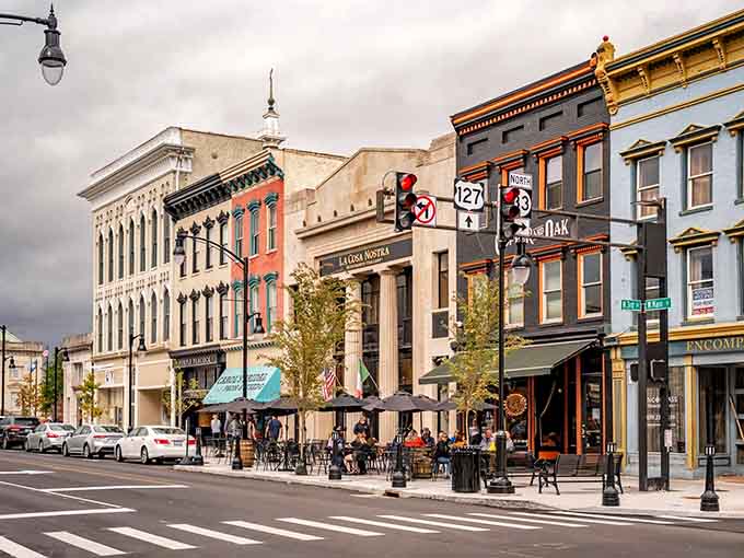 Outdoor dining thrives on these vibrant sidewalks where neighbors gather and strangers become friends over coffee.