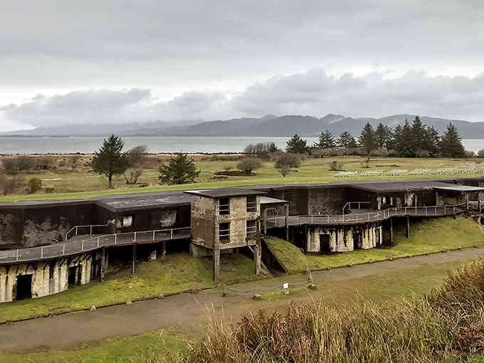 Fort Stevens sprawls across the landscape where ocean meets history, its abandoned gun batteries creating an eerily beautiful Pacific Northwest tableau.