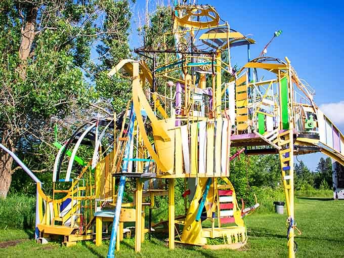 This rainbow explosion of creativity looks like Dr. Seuss designed a playground after visiting an art museum.