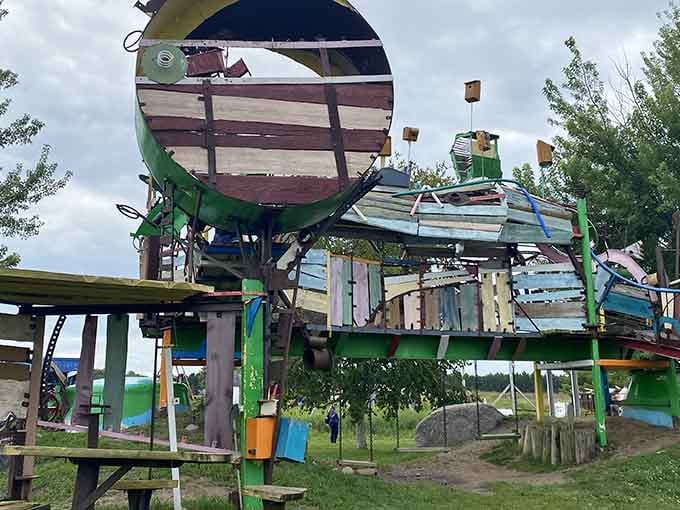 Recycled materials transform into whimsical structures proving one person's junk is another's outdoor masterpiece.