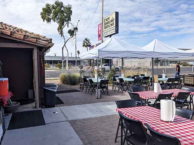 Those checkered tablecloths under white tents signal serious comfort food served with zero pretension and maximum flavor.