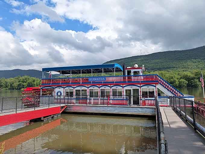 Docked against dramatic mountain views, this riverboat promises leisurely cruises where your biggest worry is choosing which deck to enjoy.