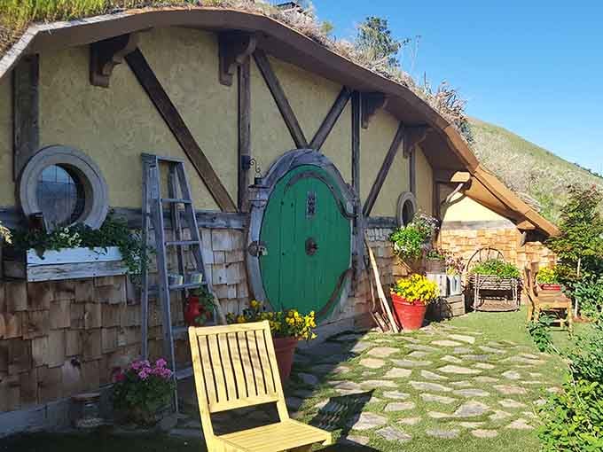 The bright green door welcomes you to Middle Earth, complete with flower boxes and mountain views.