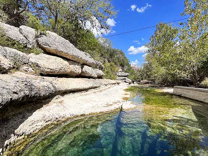 Sunlight dances across the spring-fed waters, revealing why this natural wonder has captivated visitors for generations.