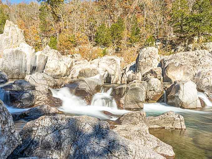 Watch the river dance through pink granite formations, its misty cascade proving Mother Nature's the ultimate landscape architect here.