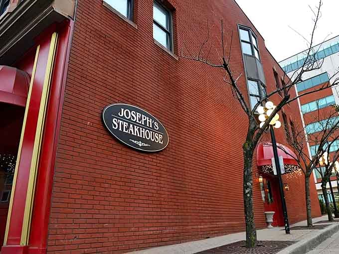 The classic oval sign against warm brick tells you everything: this is where serious steak lovers gather for dinner.