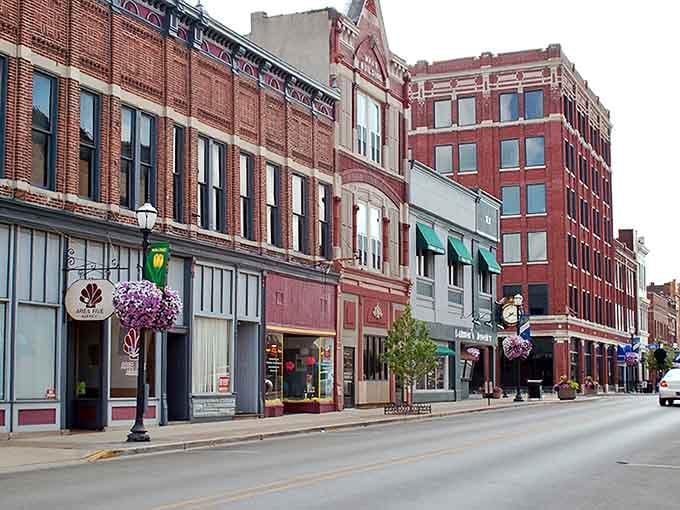 Hanging flower baskets and historic storefronts create a Main Street that Norman Rockwell would've loved painting.